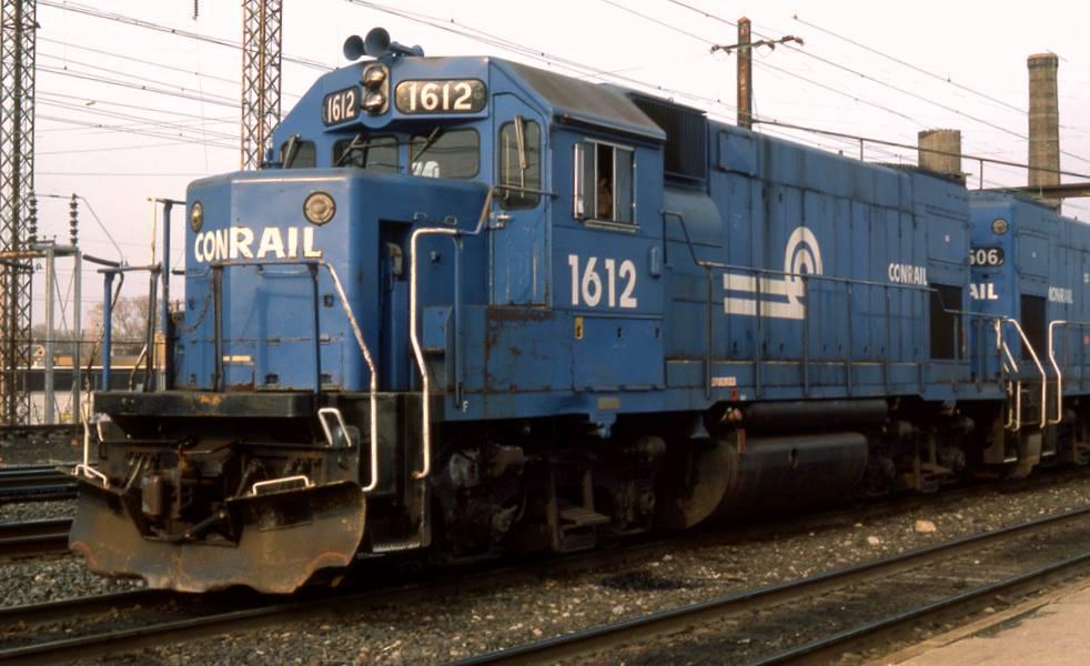 CR 1612 leads a westbound through the station at Frankford Junction ...