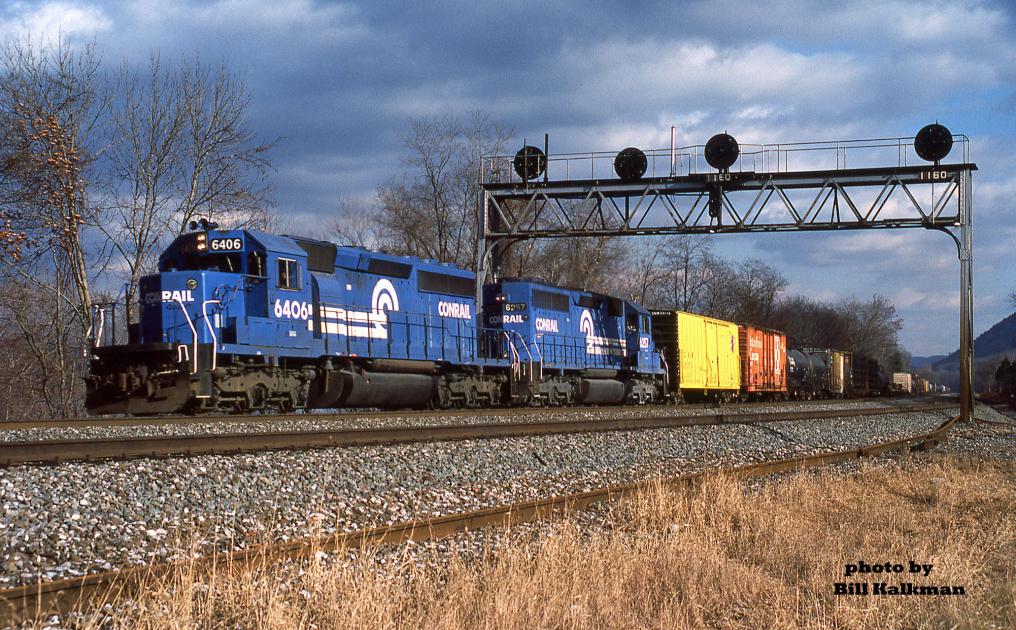 CR 6406 & 6257 are W/B on the PITL at MP 116 in Cove, PA 12/84. | Conrail Photo Archive