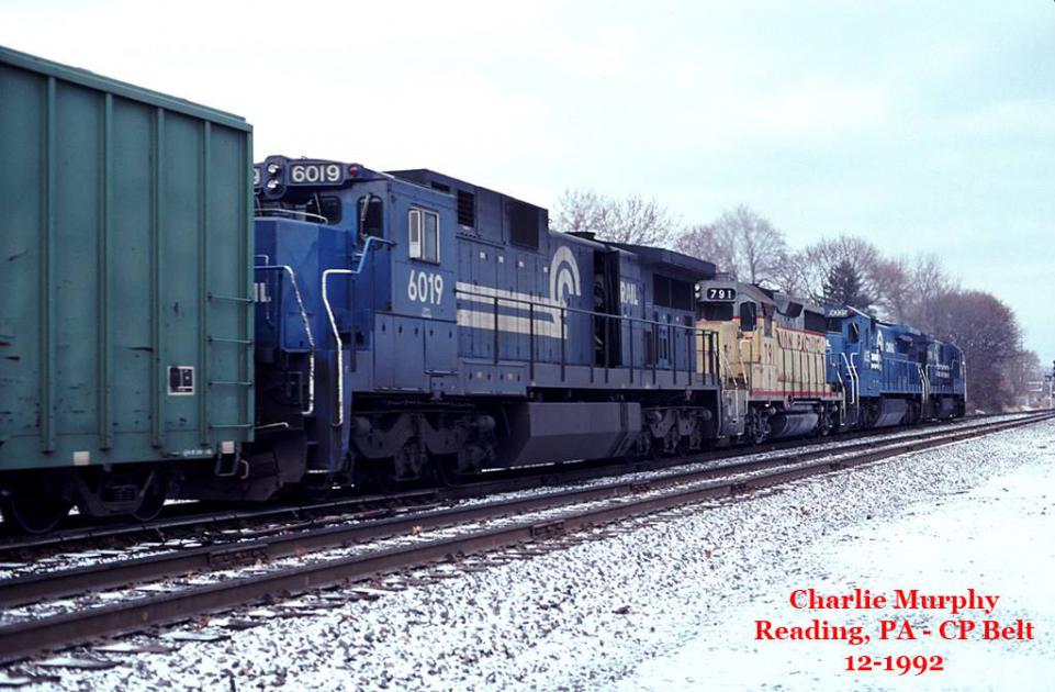 CR 6019 is lead by a pair of Conrail units and a UP GP35 in December of ...